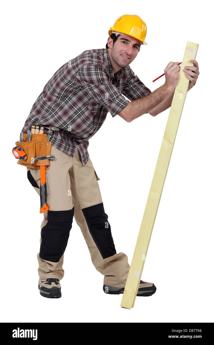craftsman measuring a board Stock Photo - Alamy