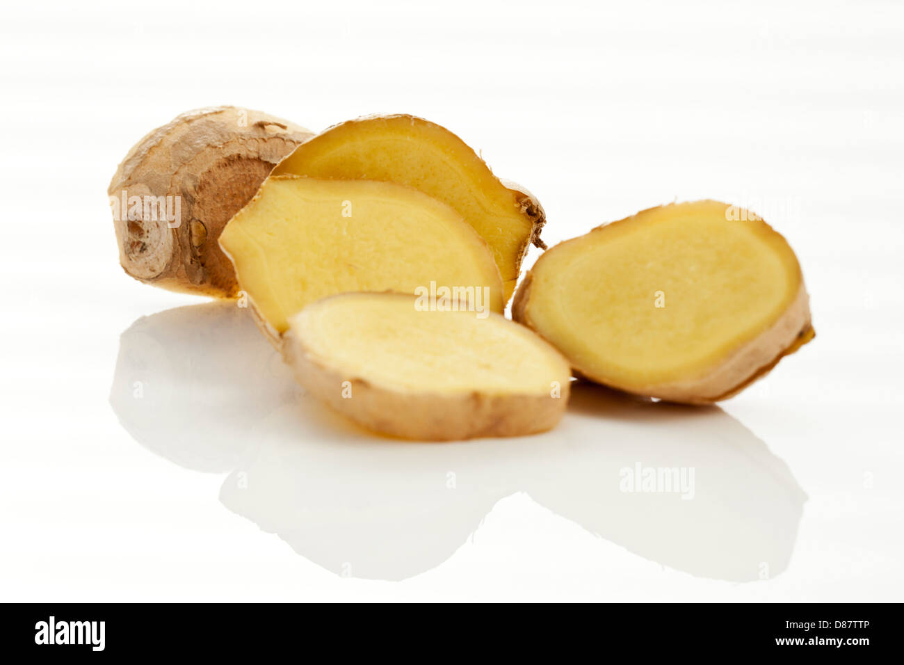 Sliced ginger on white background, close up Stock Photo - Alamy