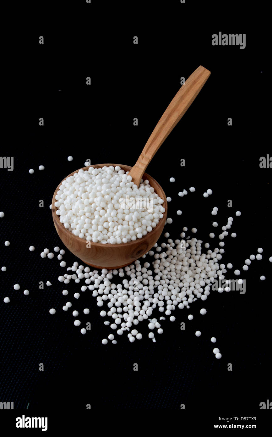 Tapioca pearls in small wood bowl on black background Stock Photo - Alamy