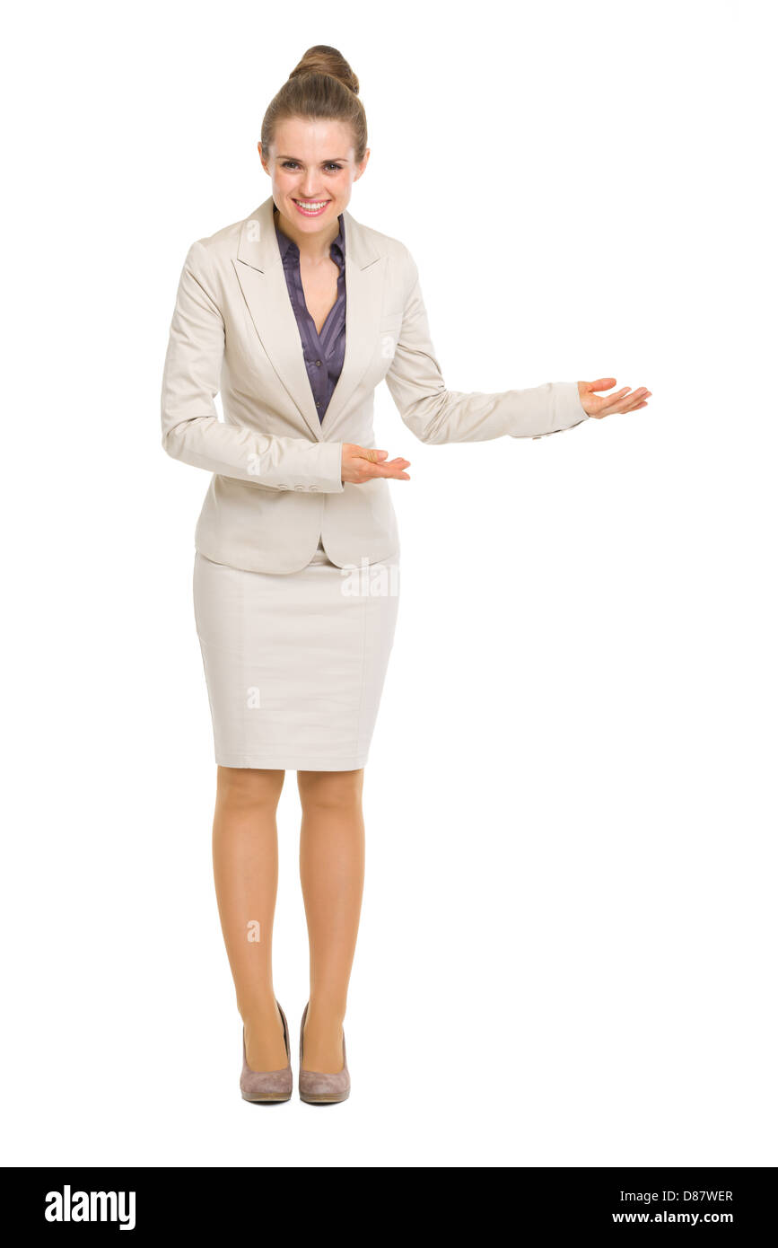 Full length portrait of business woman inviting Stock Photo - Alamy
