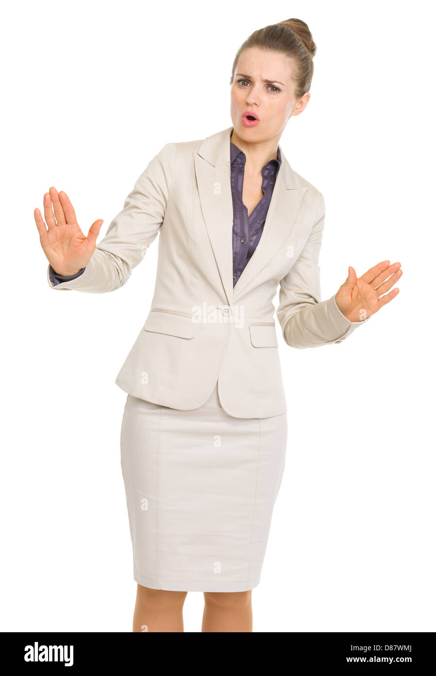 Business woman showing calm down gesture Stock Photo - Alamy