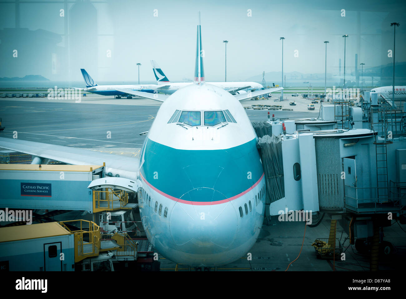 Airplane docked getting ready to flight Stock Photo - Alamy