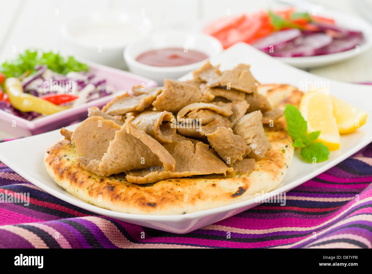 Donner Meat on Naan - Slices of donner meat on top of a flatbread ...