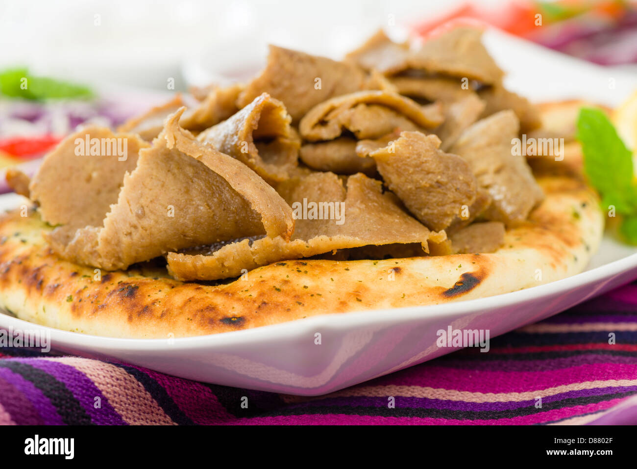 Donner Meat on Naan - Slices of donner meat on top of a flatbread ...