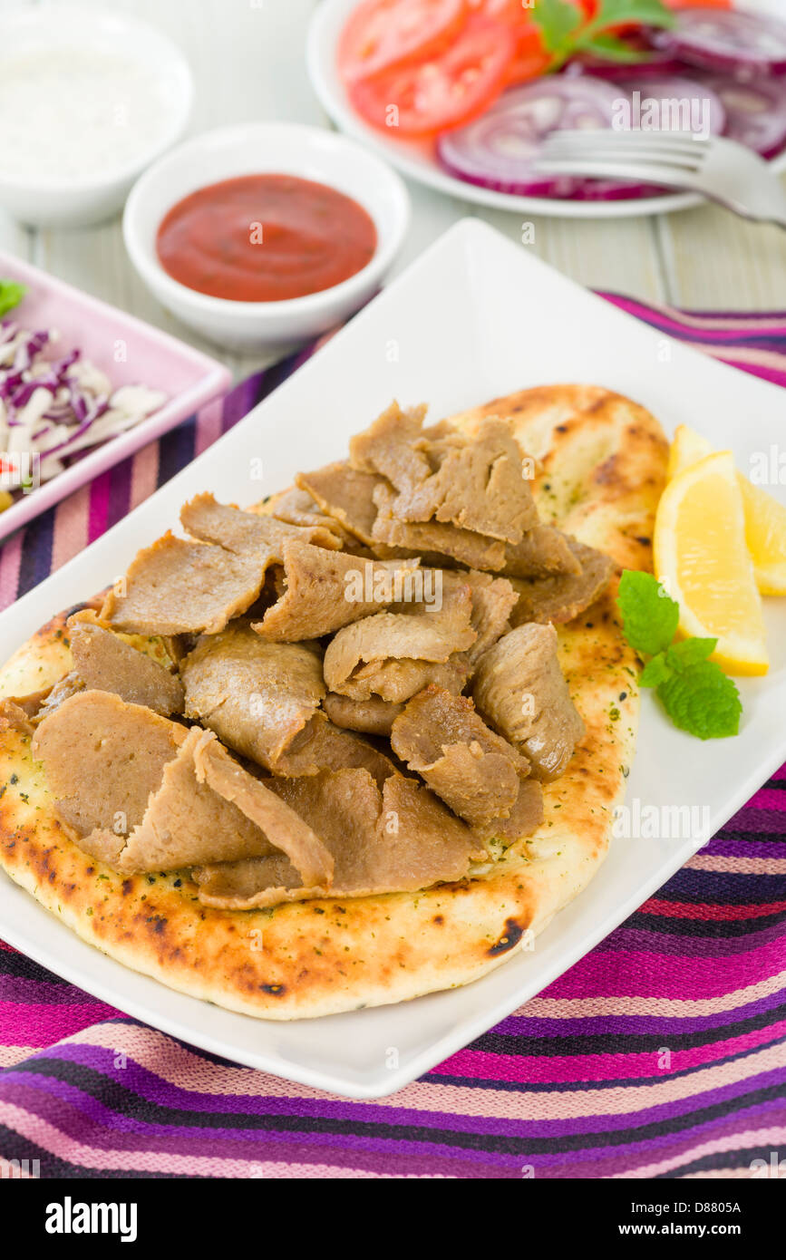 Donner Meat on Naan - Slices of donner meat on top of a flatbread ...