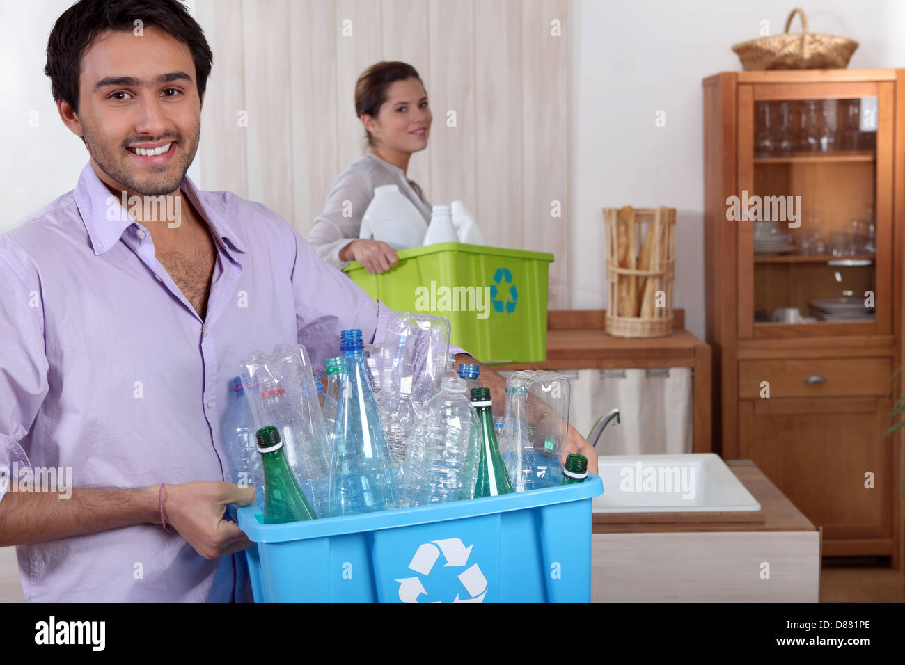 couple doing recycling Stock Photo - Alamy