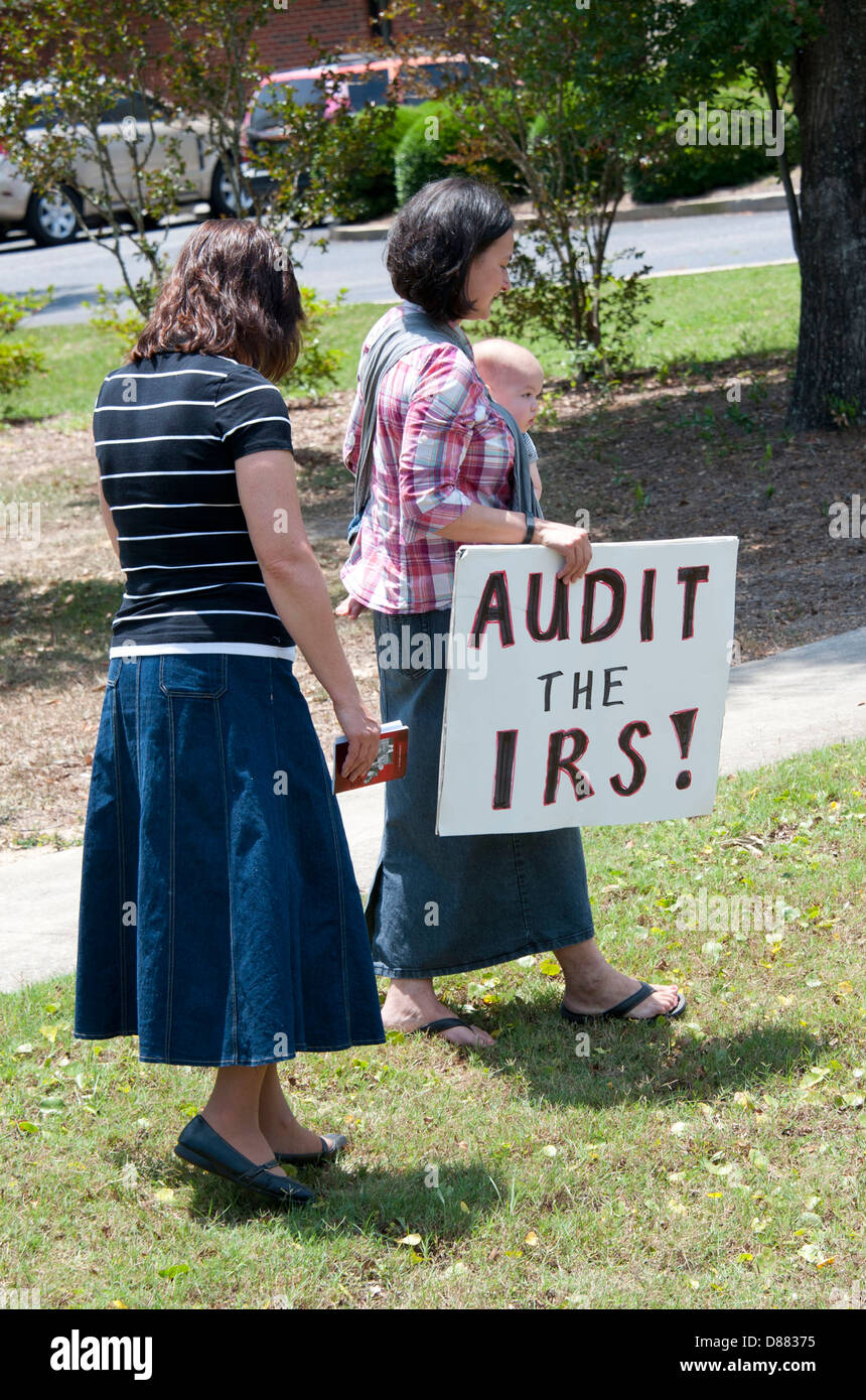 Protesters demonstrate outrage over reports that the IRS targets ...