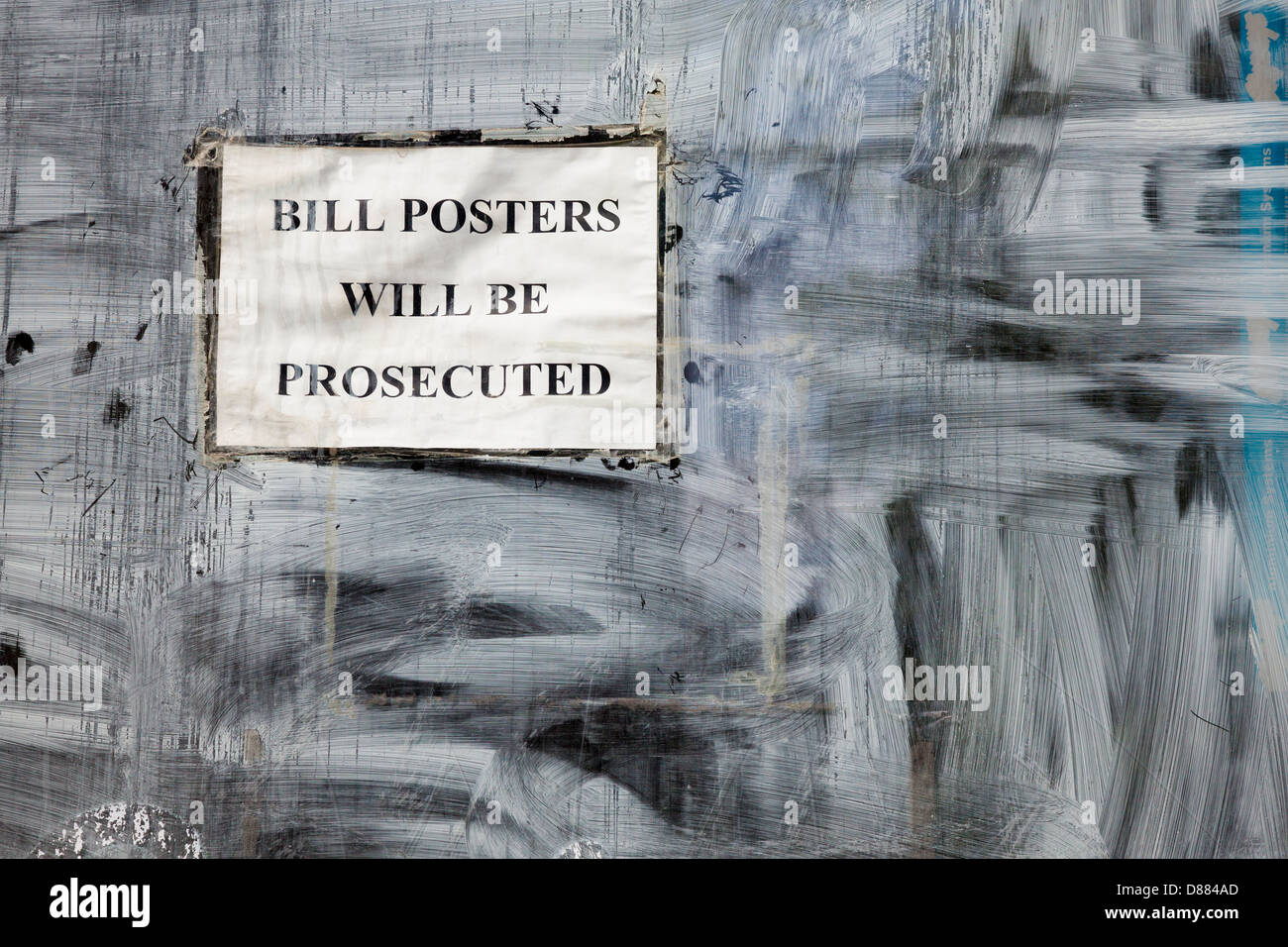 White-washed shop window with "Bill posters will be prosecuted" sign ...
