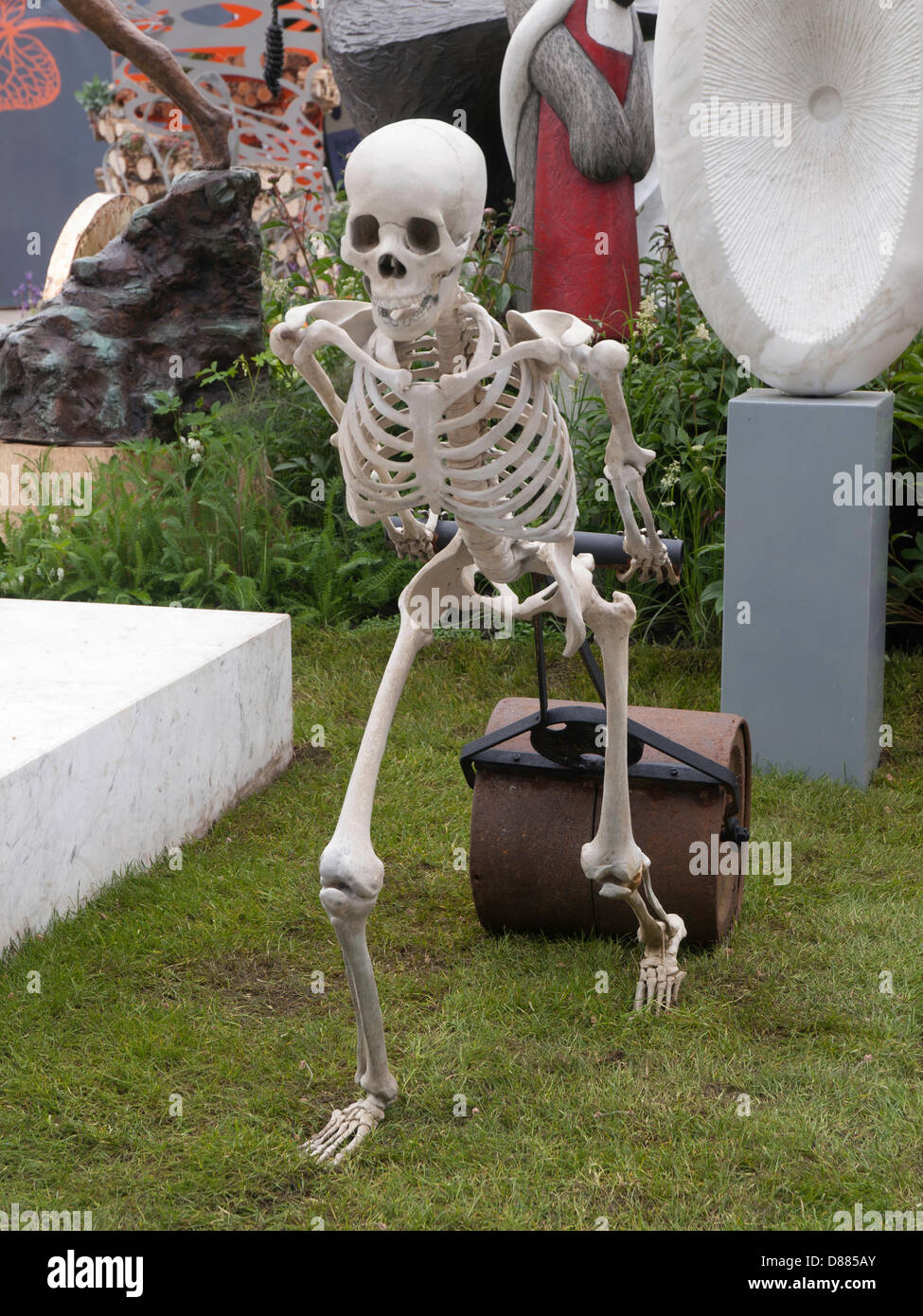London, UK. 20th May 2013. skeleton with garden roller. London, UK ...