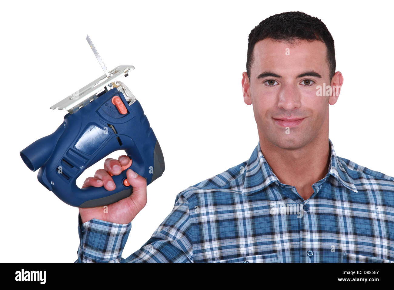 Man holding band-saw Stock Photo - Alamy