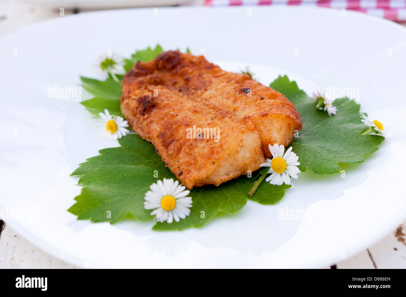 Fried catfish steak on the plate Stock Photo - Alamy