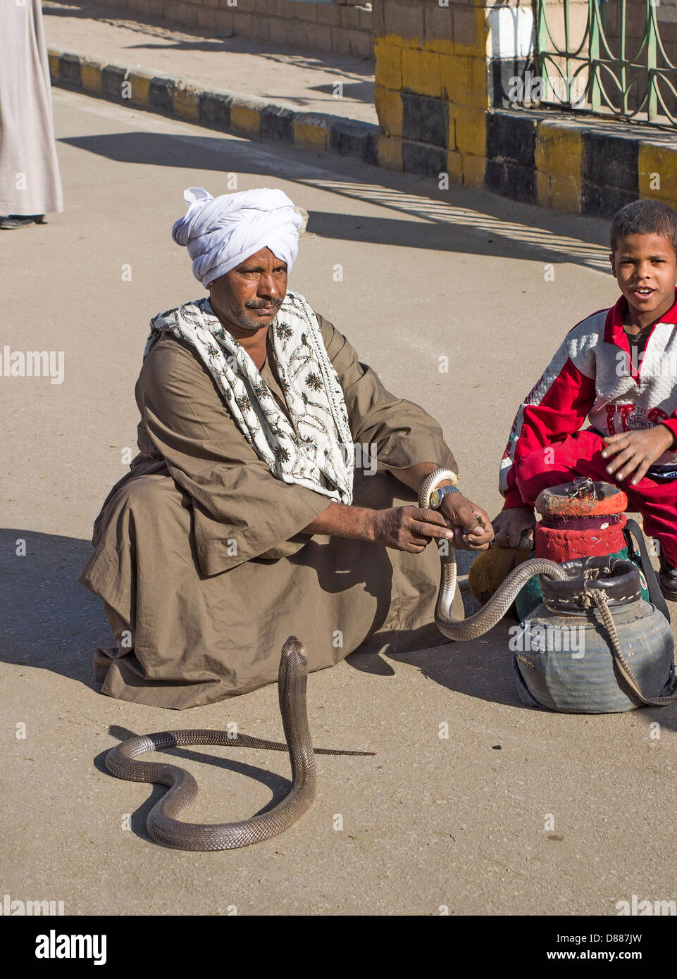 Snake charmer in Esna, Egypt with cobras - Egyptian Arab with white ...