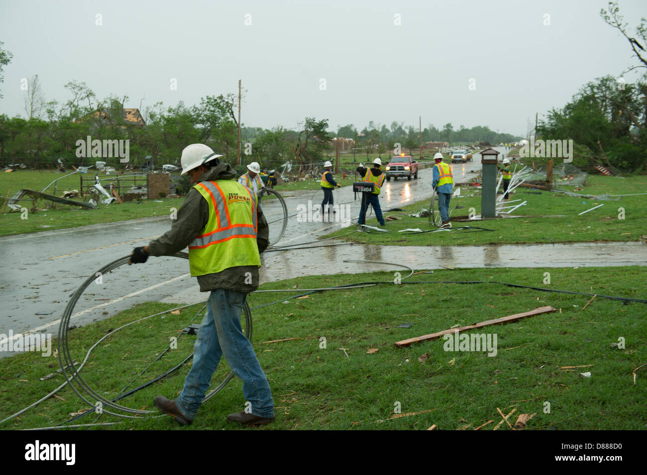Oklahoma, USA. May 21, 2013. Electrical crews roll up transmission ...