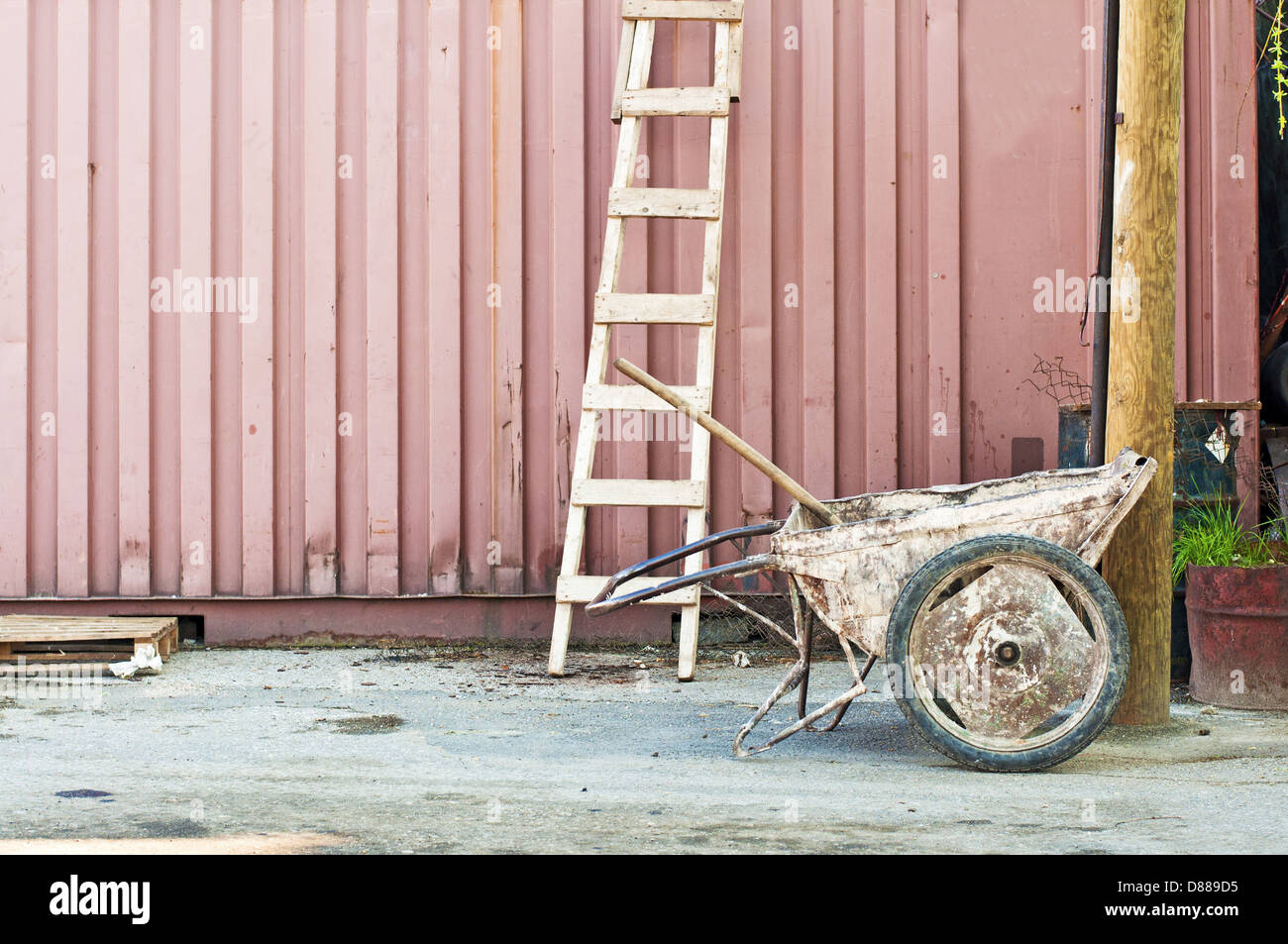 Old industrial cart and wood ladders in the abandoned factory yard ...