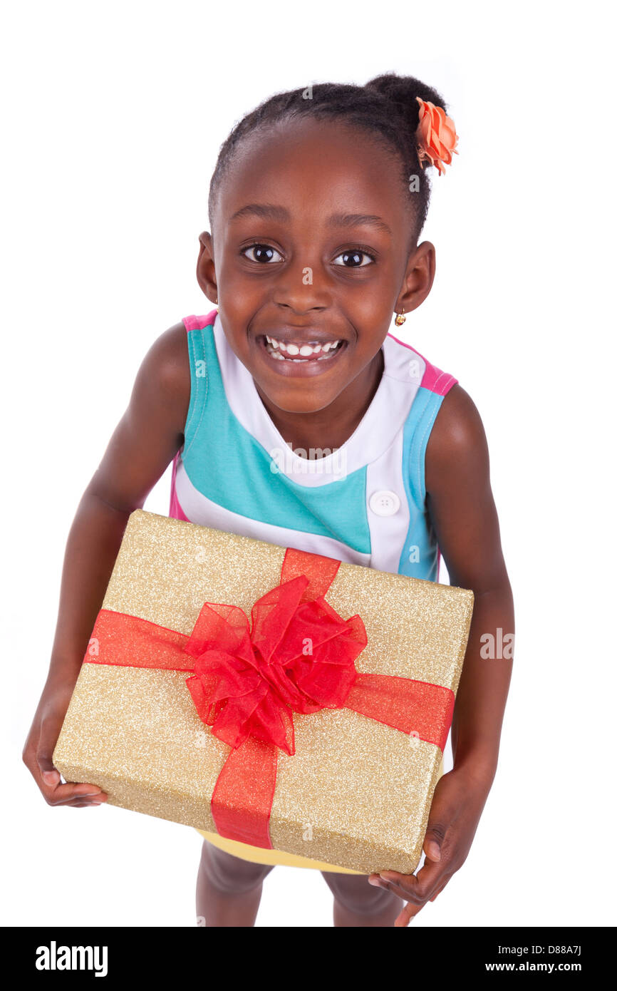 Young African American little girl holding a gift box, isolated on ...