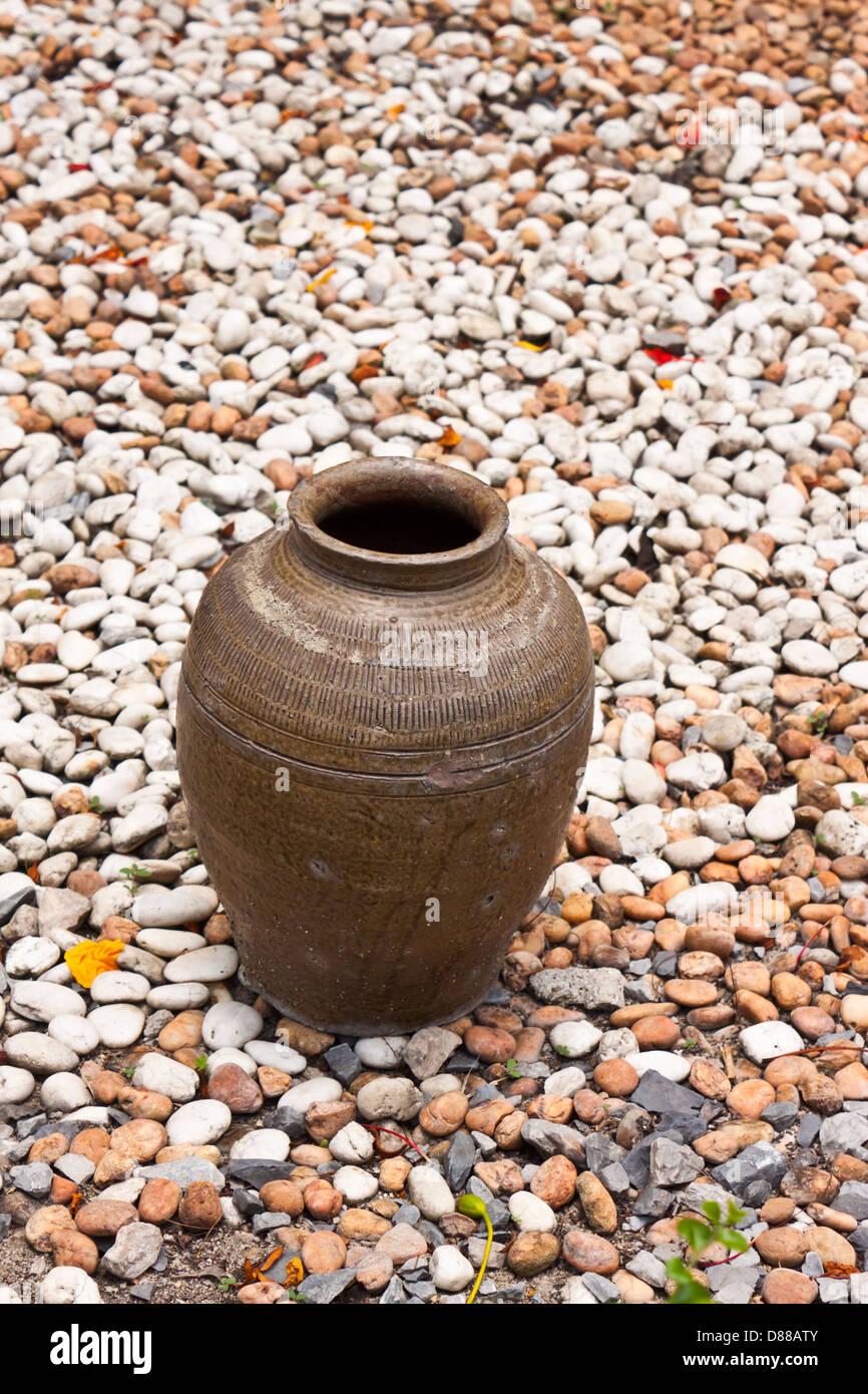 jar on a small white stone Stock Photo - Alamy
