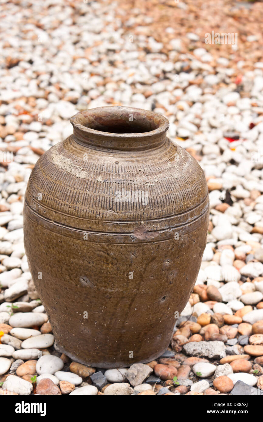 jar on a small white stone Stock Photo - Alamy