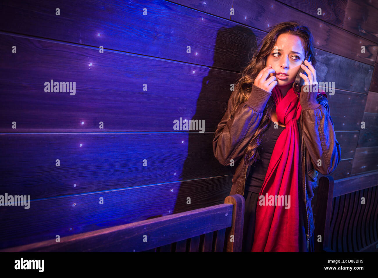 Scared woman alone dark room hi-res stock photography and images - Alamy