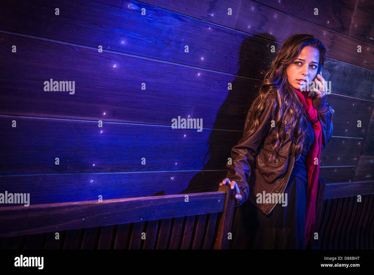 Scared woman alone dark room hi-res stock photography and images - Alamy