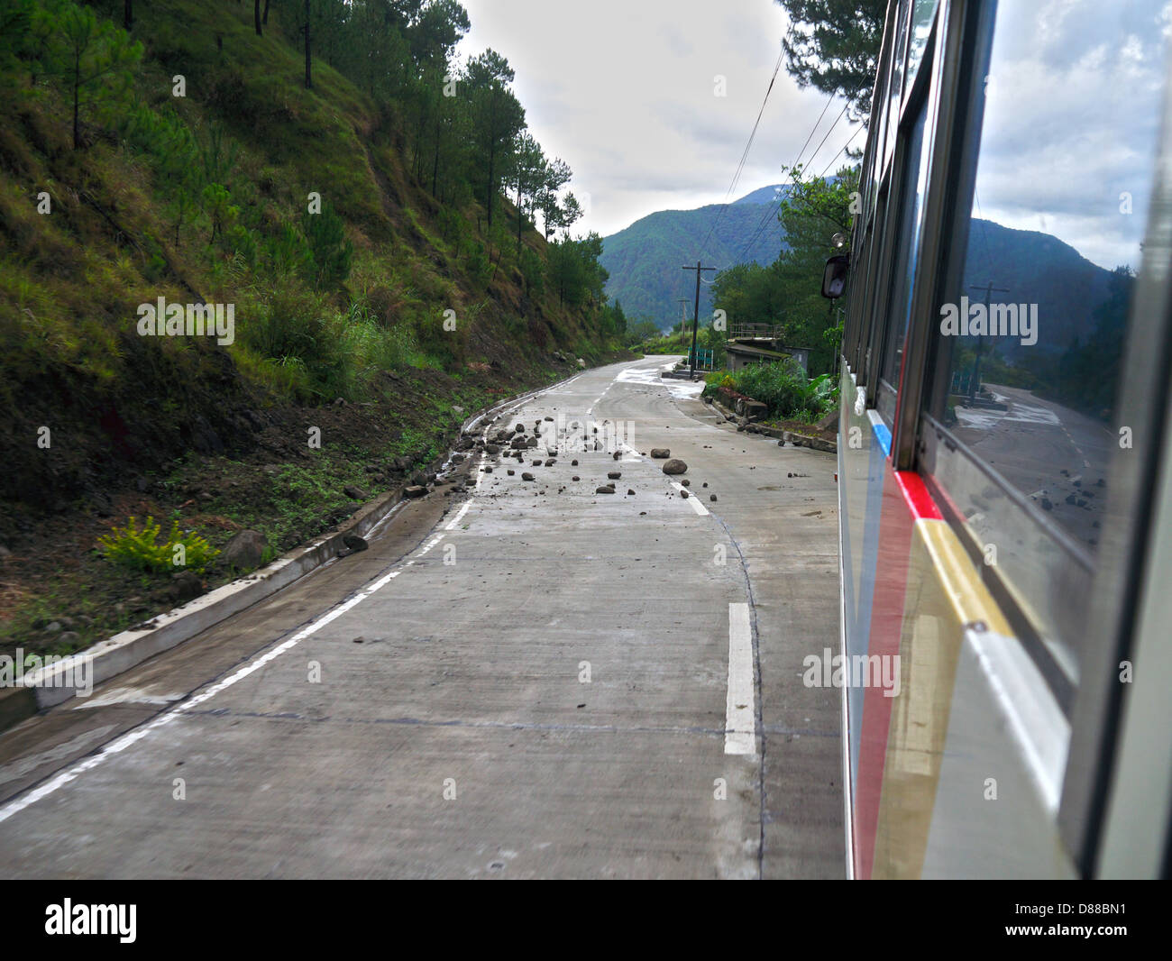 Rockfall on the road Stock Photo - Alamy