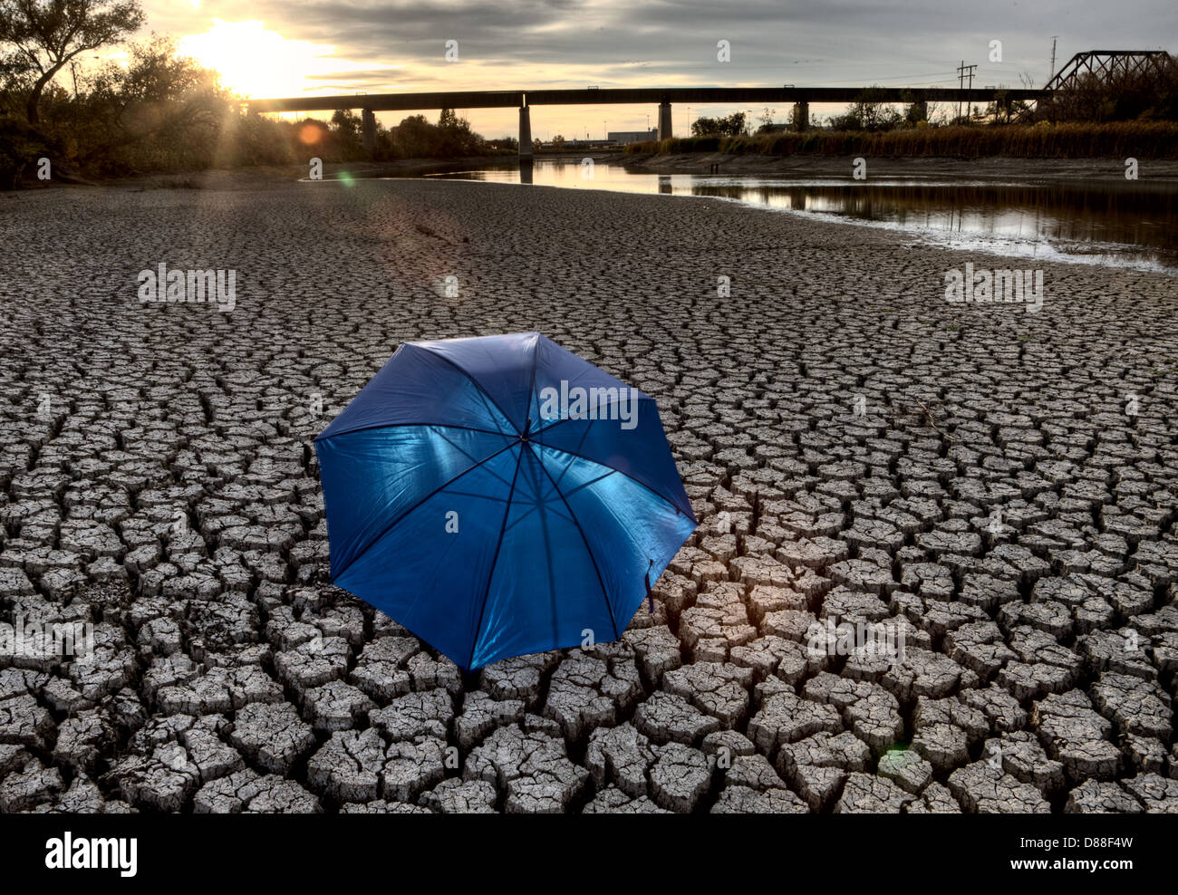 Dried up River Bed and umbrella Stock Photo - Alamy