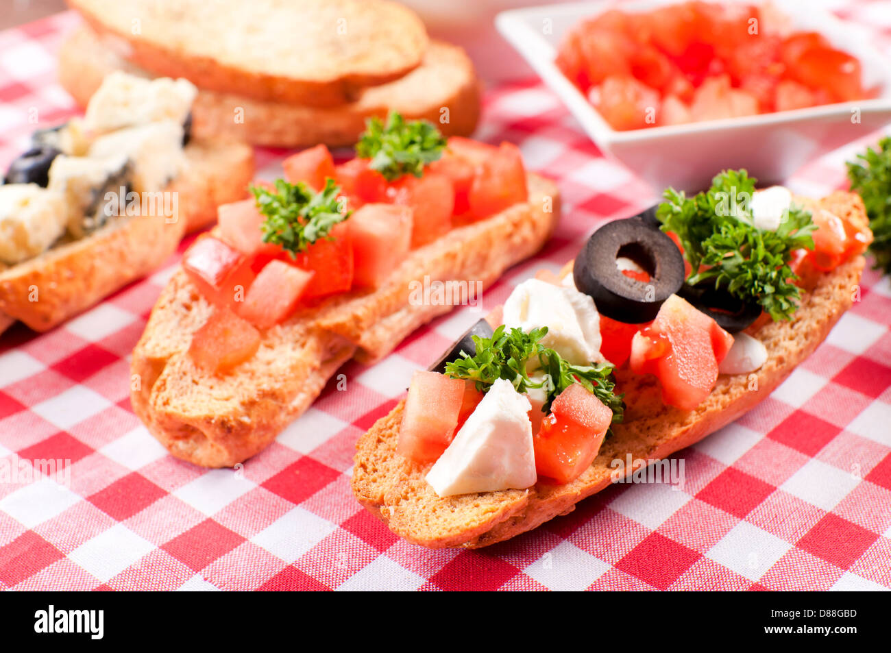 Fresh small sandwiches on the table. Selective focus on the front ...