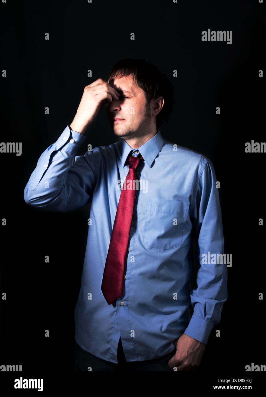 Businessman with the problems on black background Stock Photo - Alamy