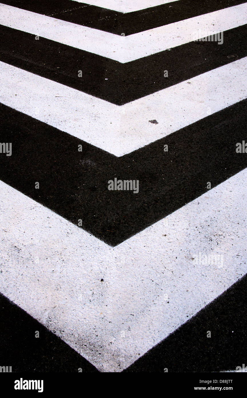 Street arrows on the road as sign Stock Photo - Alamy