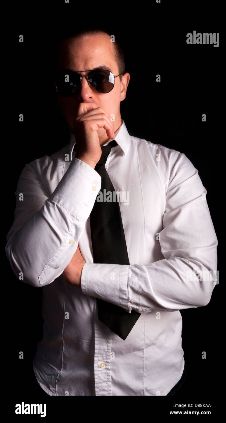 Secret agent thinking. Shoot in low key technique Stock Photo - Alamy