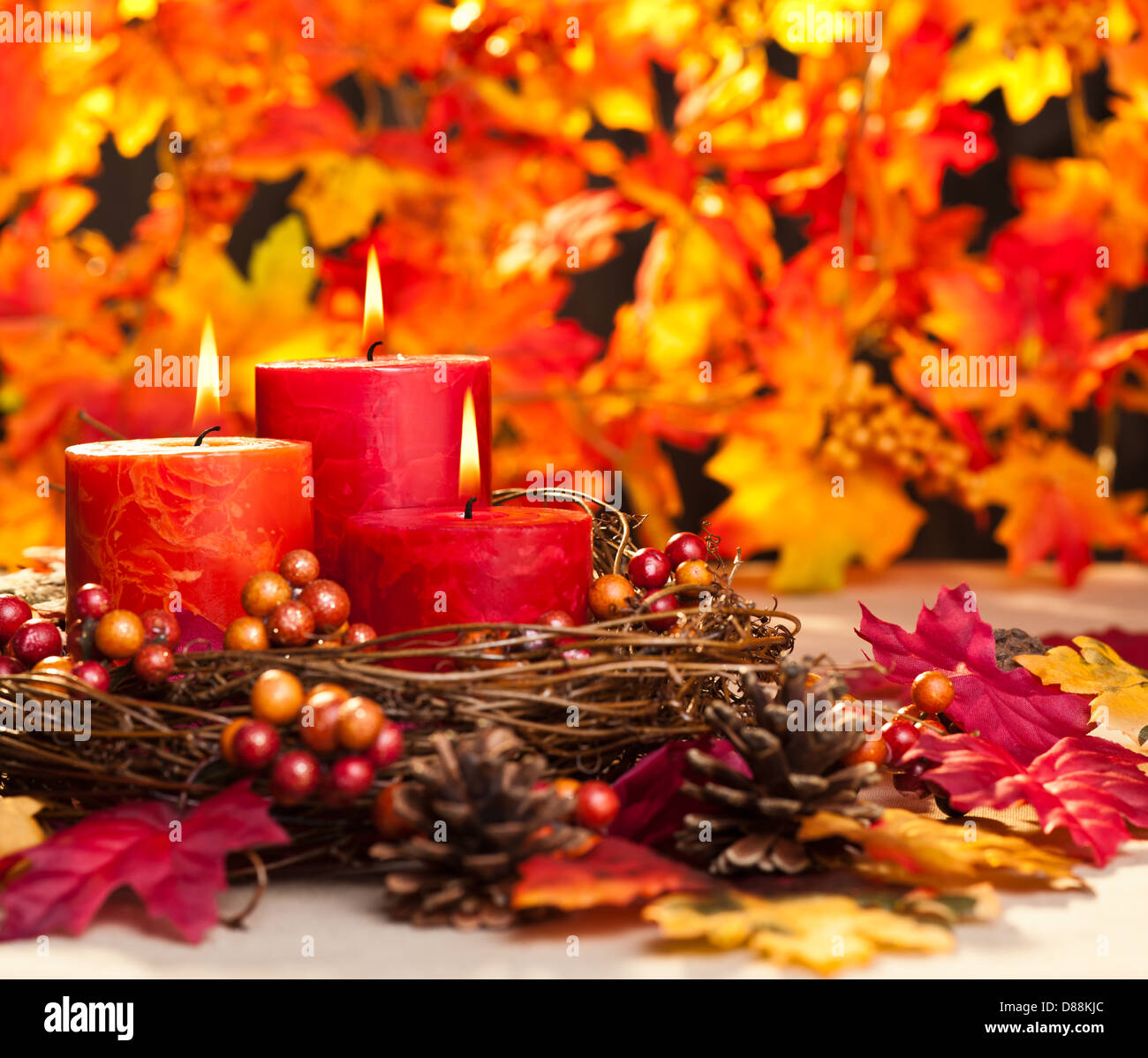 Candles in nice and beautiful colorful autumn leaves Stock Photo - Alamy