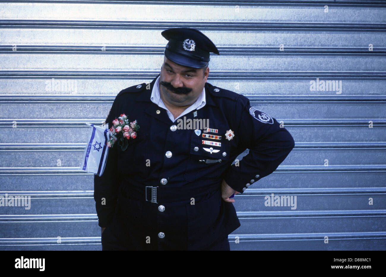 A person dressed as an Israeli policeman during Purim festival in ...