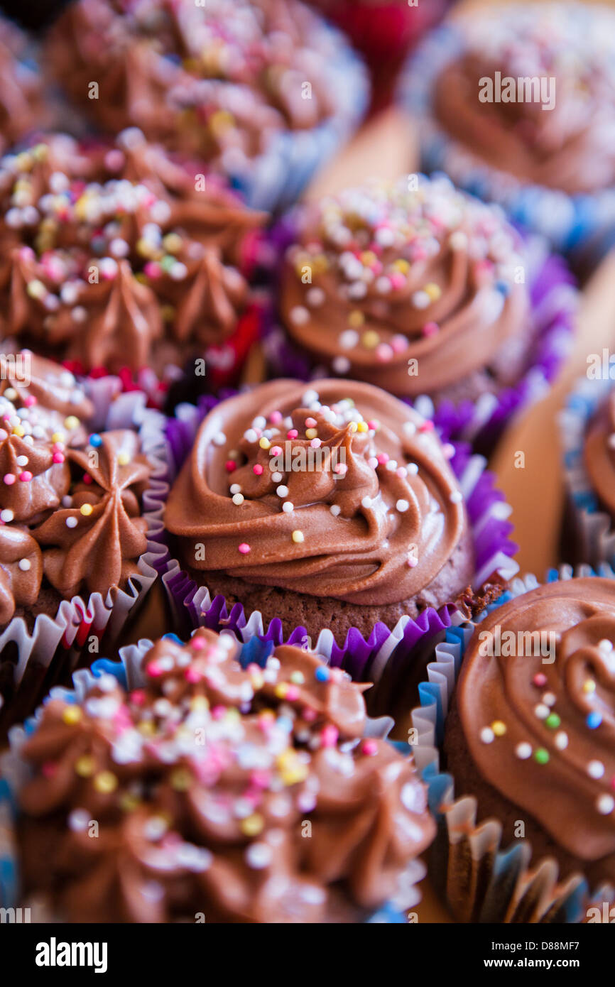Closeup of chocolate cupcakes with decorative sprinkles Stock Photo - Alamy