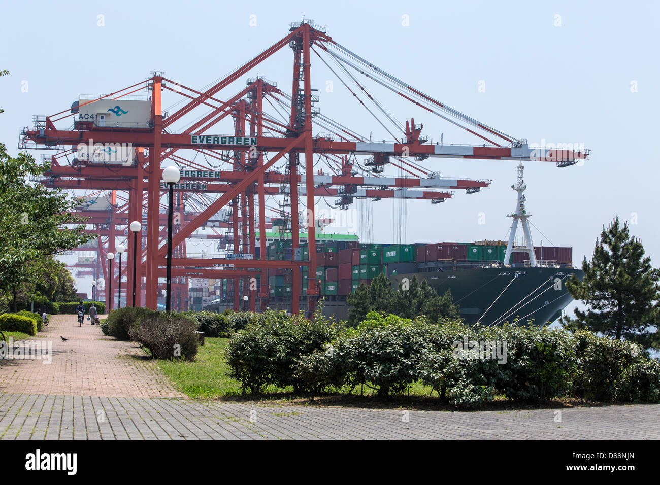 Tokyo, Japan - A container ship is docked in cargo area at a port in ...