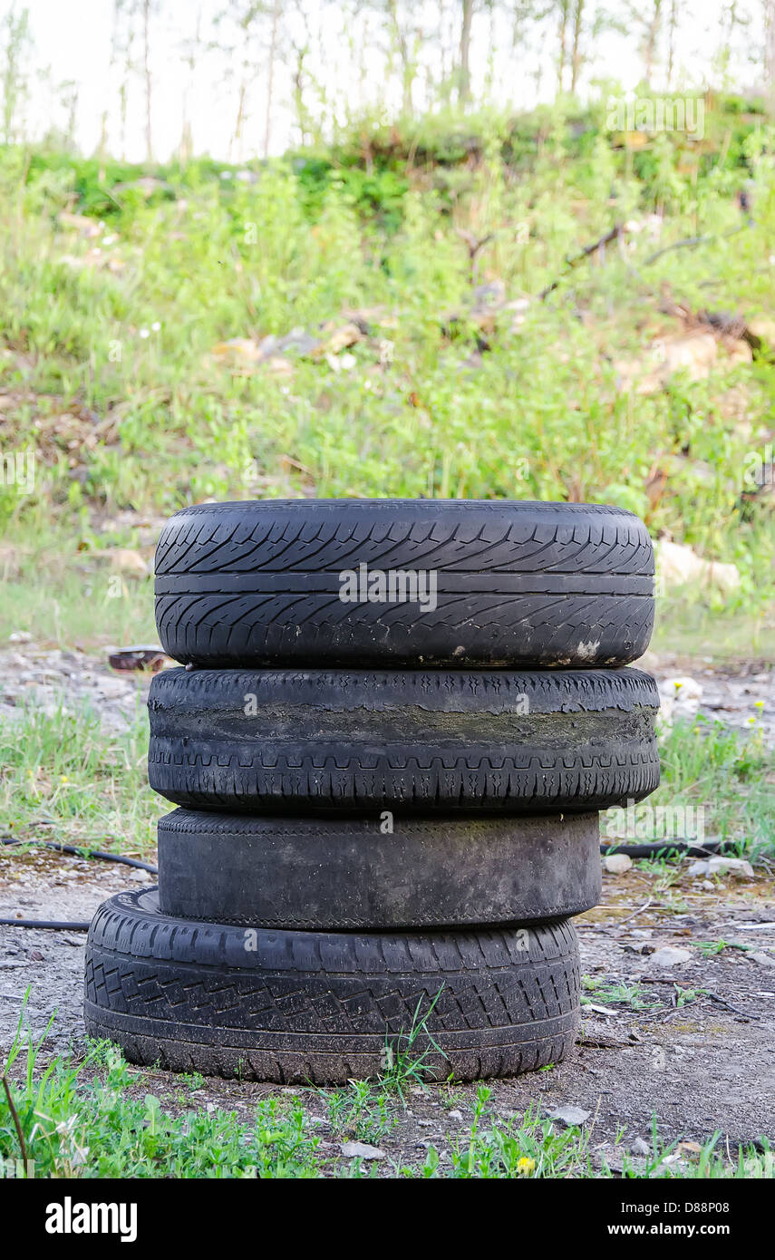 Old tires in forest Stock Photo - Alamy