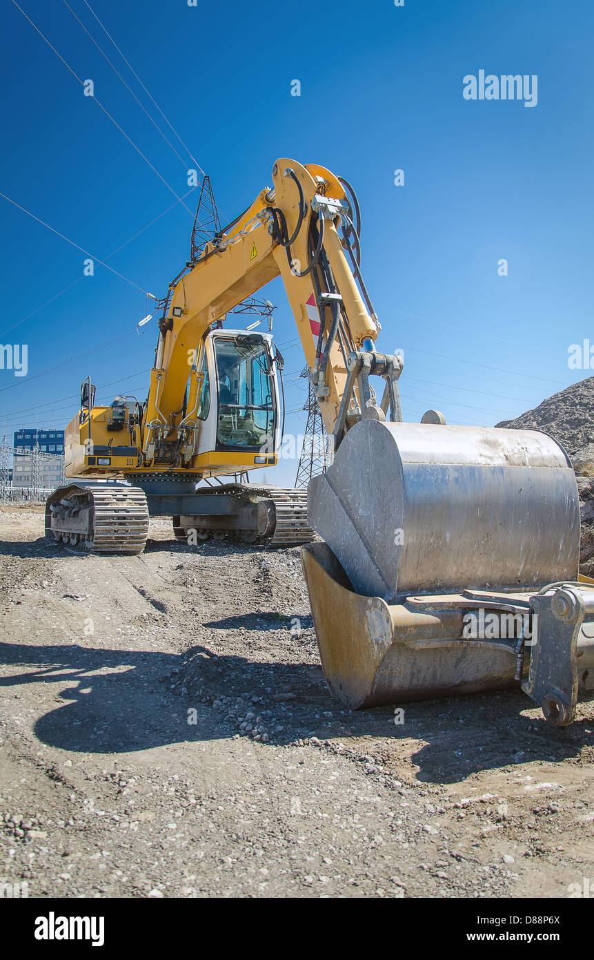 Excavator on construction site Stock Photo - Alamy