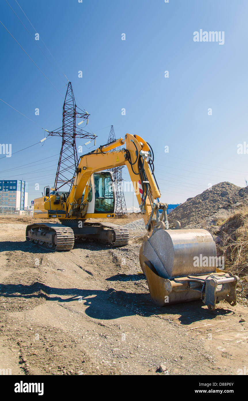 Excavator on construction site Stock Photo - Alamy