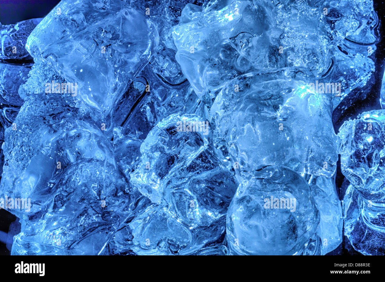 chunks of ice lay on the ground, black background Stock Photo - Alamy