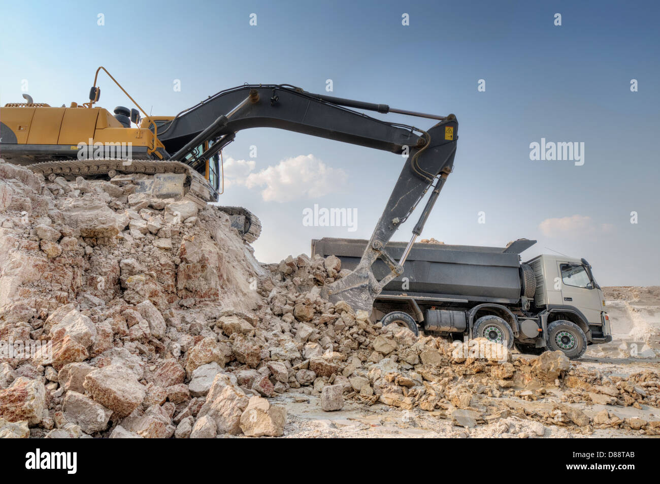 loading a large lorry building material, clay pit Stock Photo - Alamy