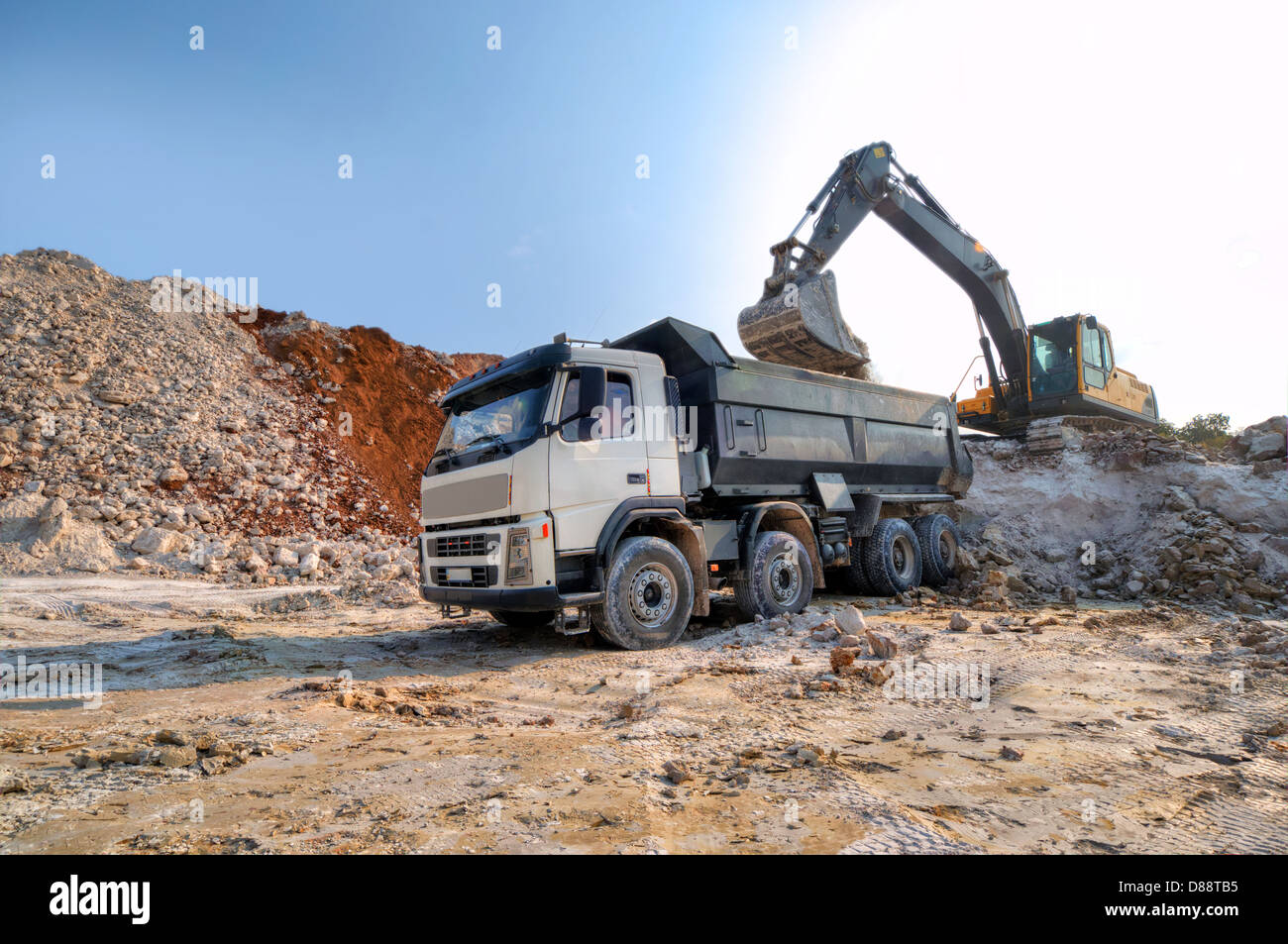 loading a large lorry building material, clay pit Stock Photo - Alamy