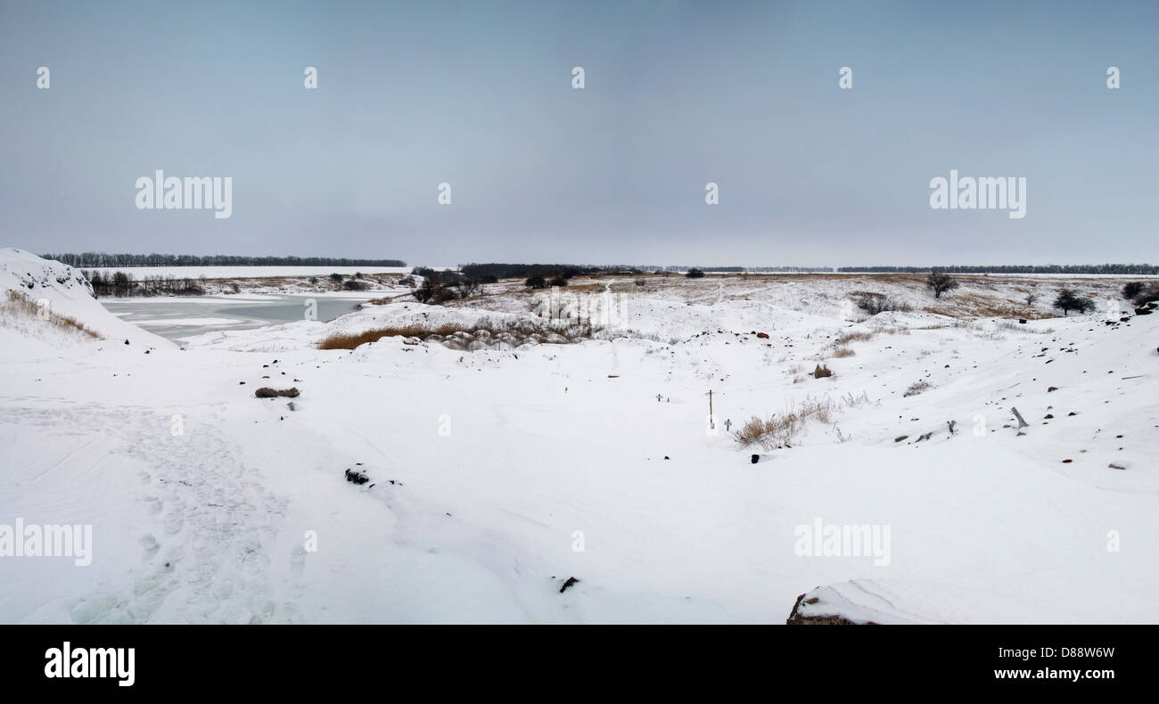 Cold winter landscape with hills and lake Stock Photo - Alamy
