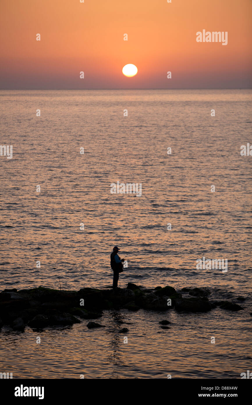 People angles at sunset Stock Photo - Alamy