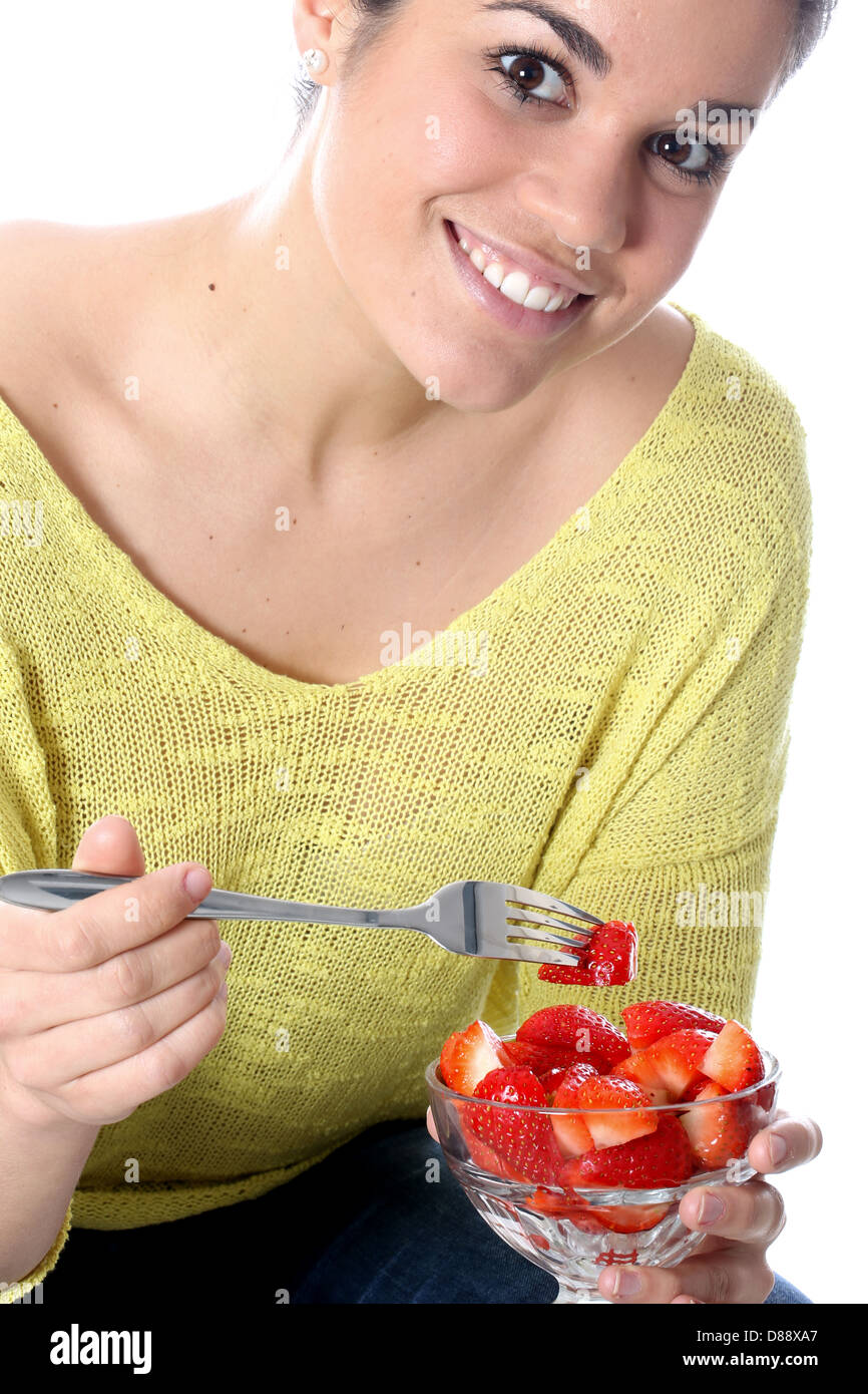 Young woman eating fresh strawberries Stock Photo - Alamy