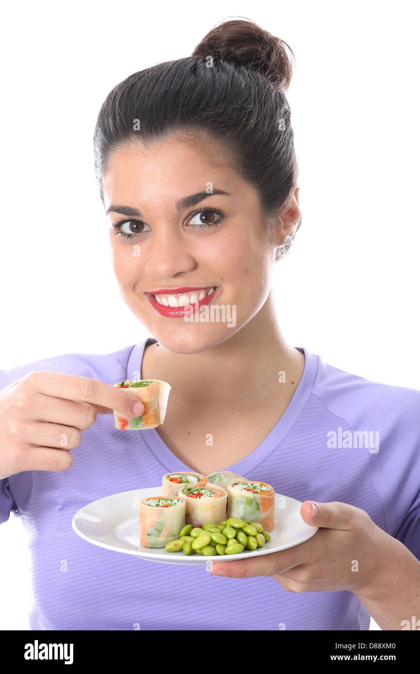 Model Released. Young Woman Eating Tuna Salad Bites Stock Photo - Alamy
