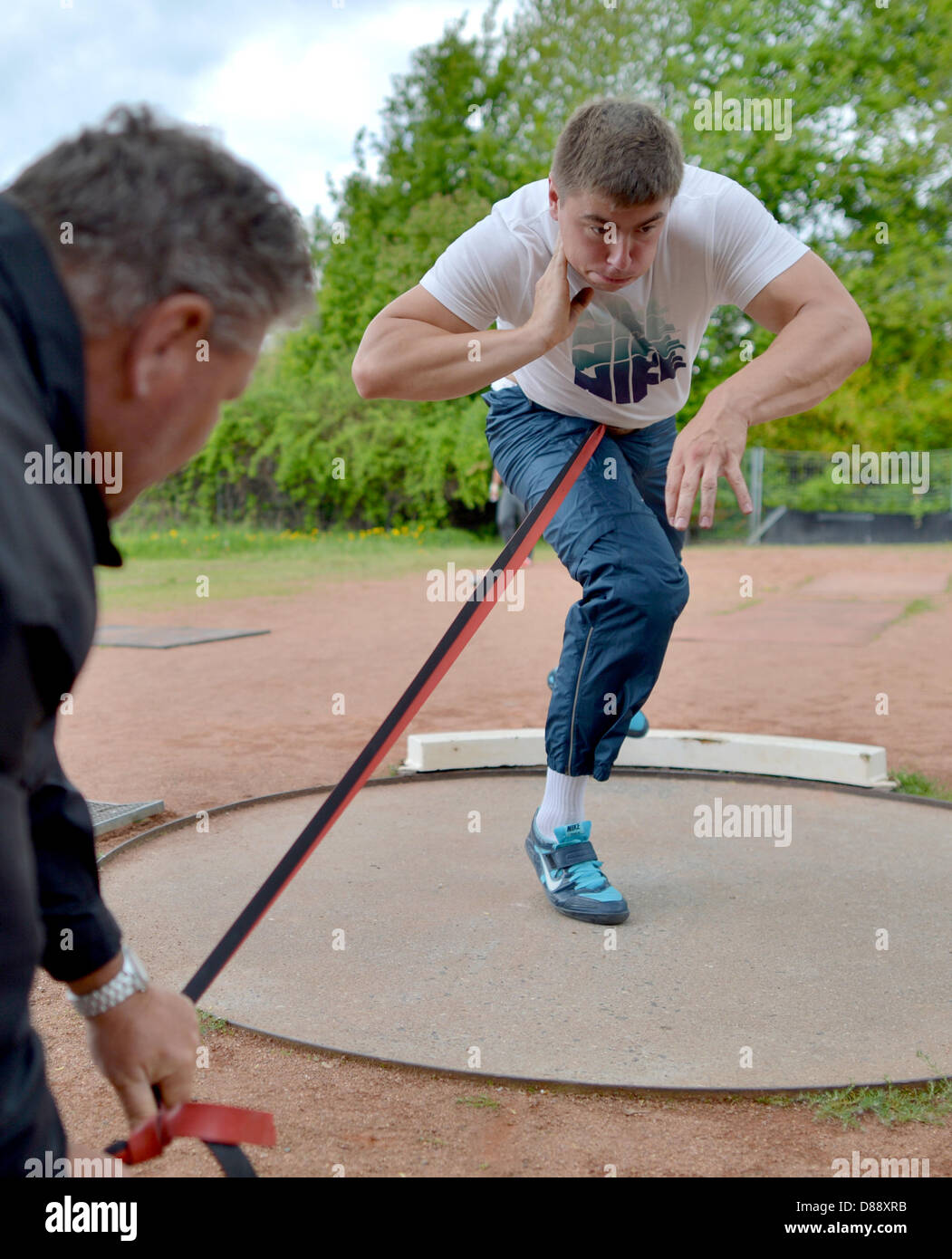 Shot Put world champion David Storl (R) practises at the Sports Forum ...