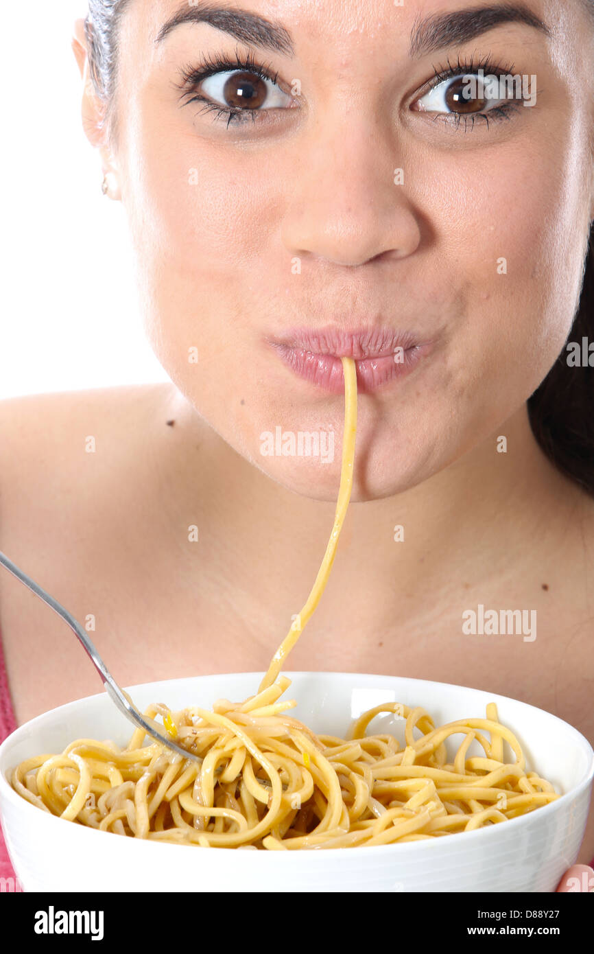 Happy woman eating noodles hi-res stock photography and images - Alamy