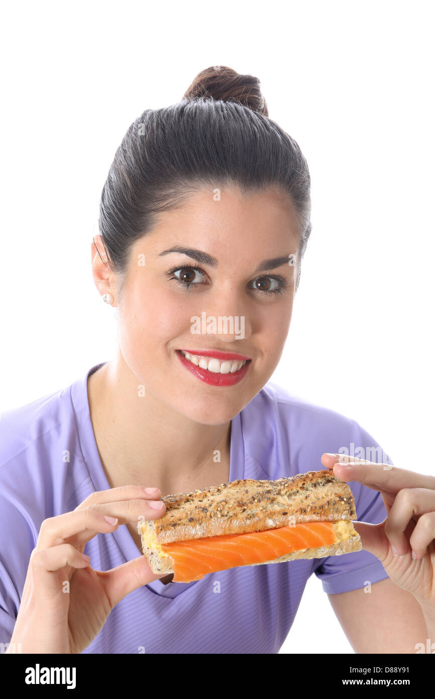 Model Released. Young Woman Eating Smoked Salad Roll Stock Photo - Alamy