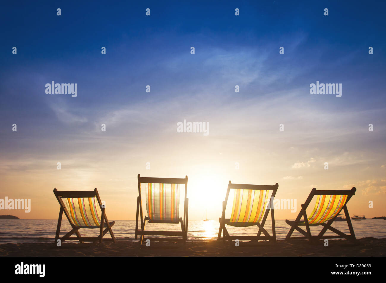 Beach chairs at sunset hi-res stock photography and images - Alamy