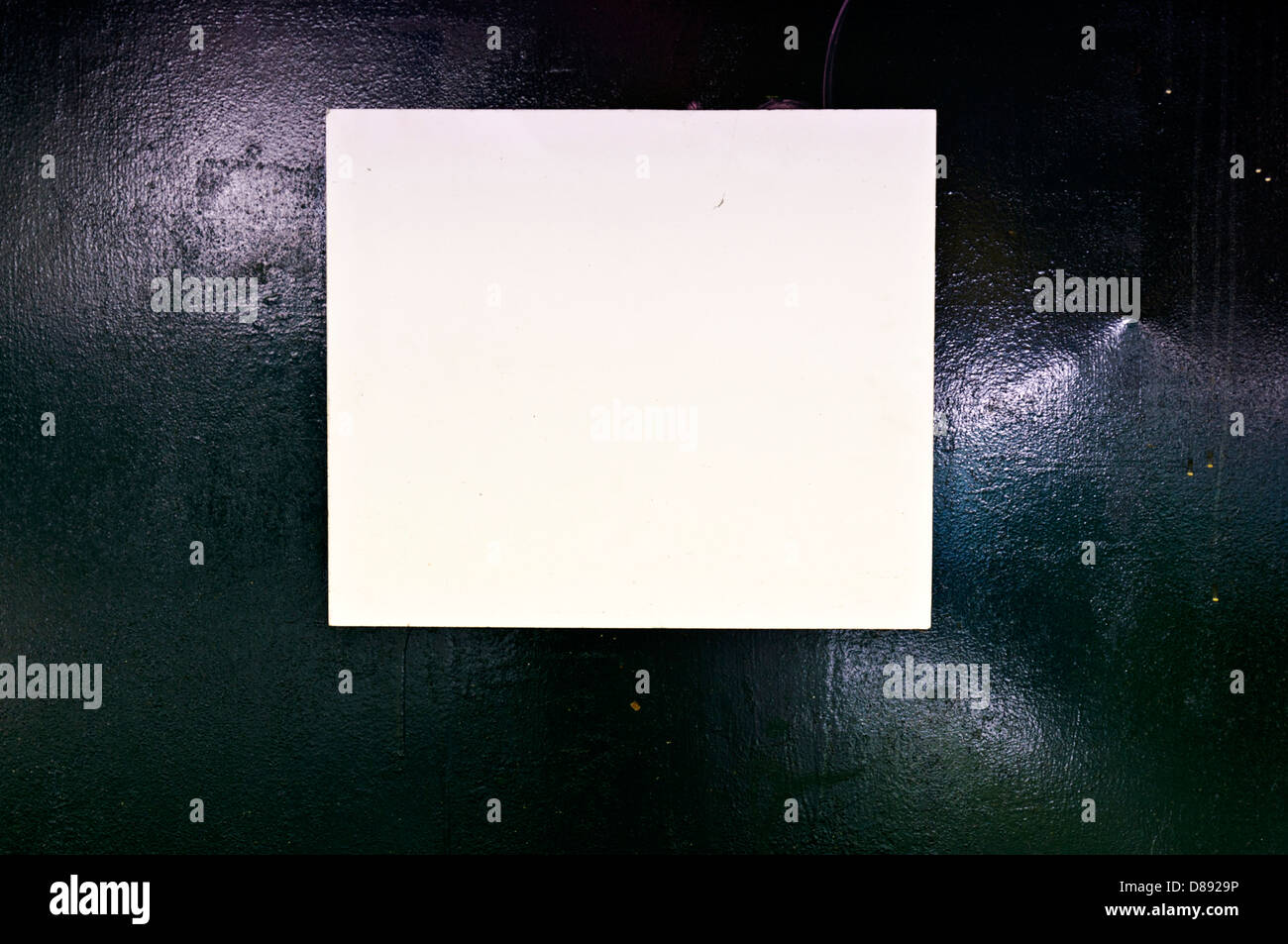 Blank paper on black metal Stock Photo - Alamy