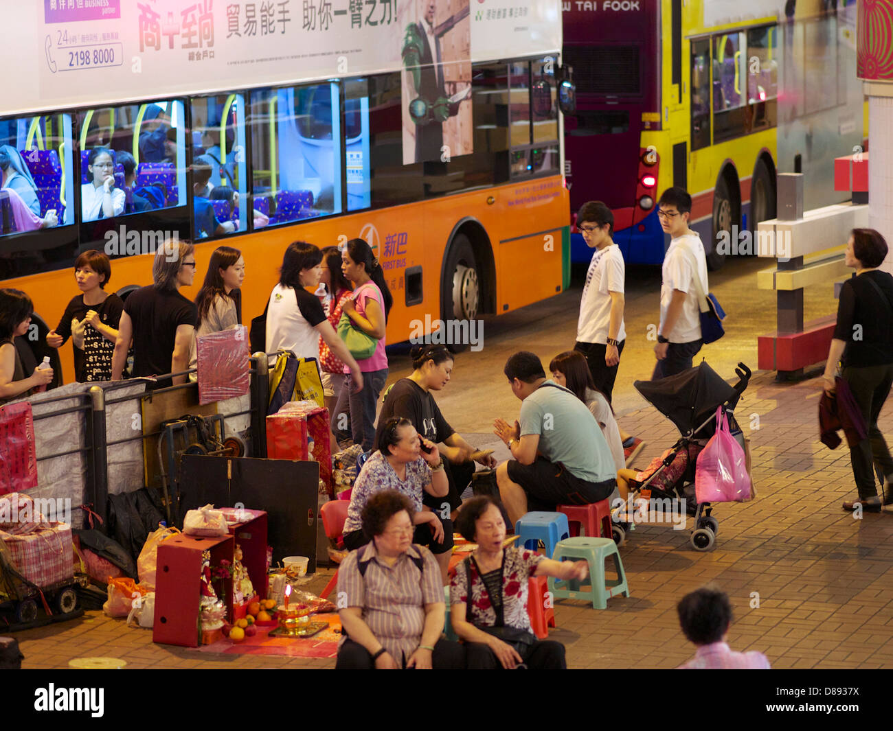 Scene of Wan Chai bus terminal. Located inside are old women providing ...