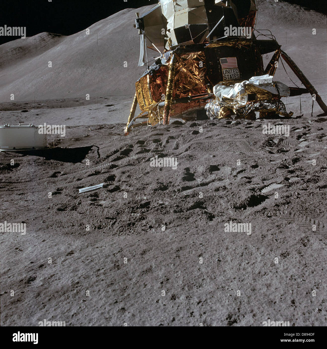 The Apollo 15 mission's Lunar Module Falcon is shown tilted on the lunar surface during its ...